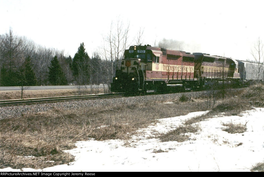 SORE train north at Trombley Rd, MP 136, Ore Sub. Date unknown.